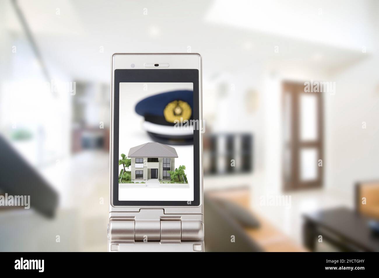 Security image on mobile phone screen and inside room Stock Photo - Alamy