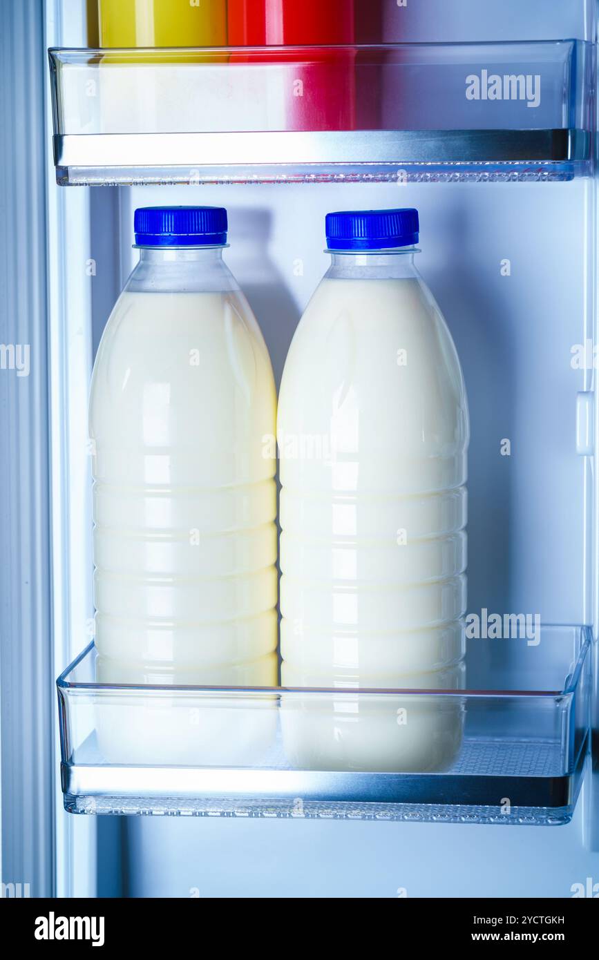 Bottles of milk in the fridge Stock Photo - Alamy