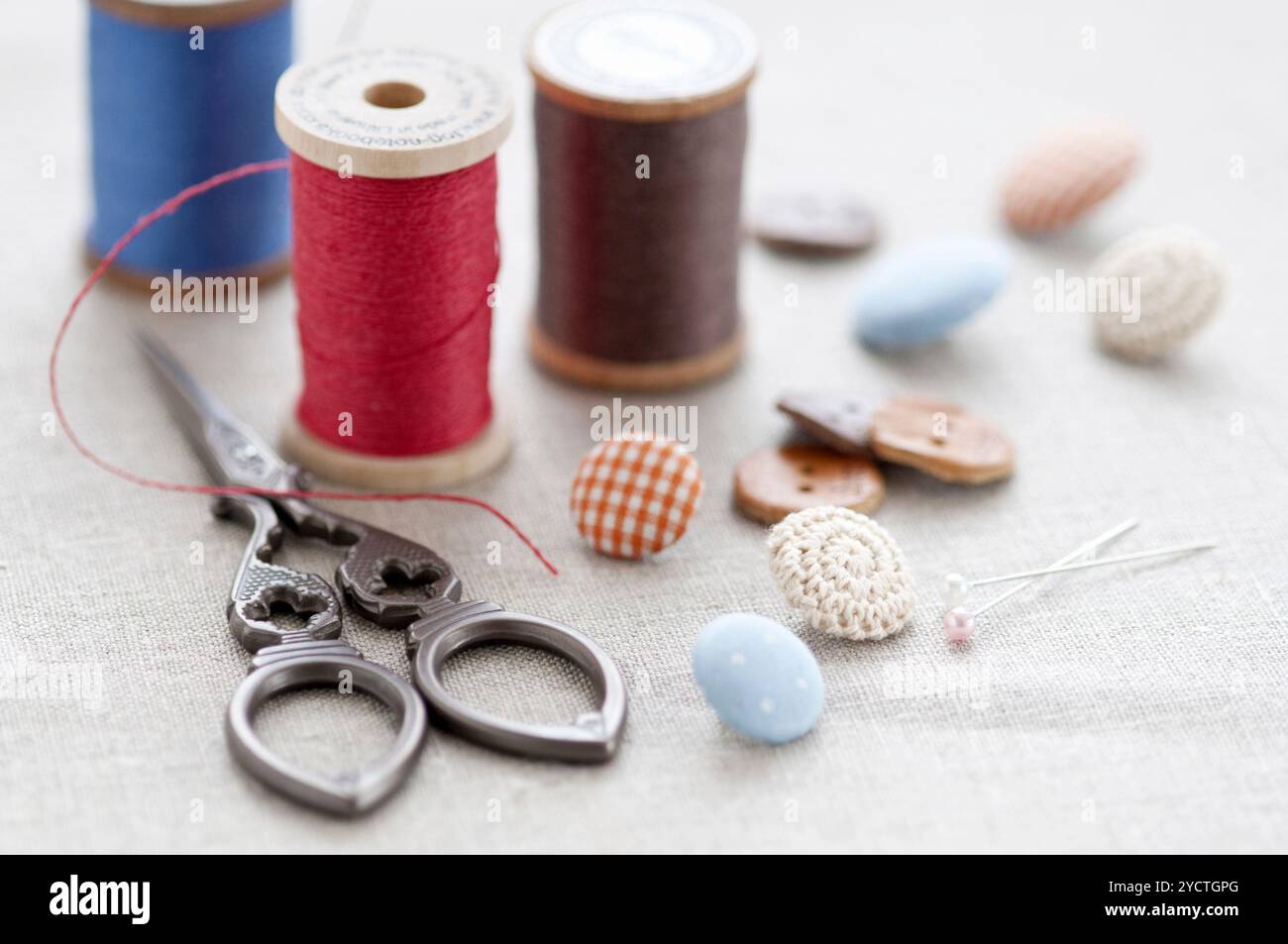 Buttons, thread and scissors Stock Photo - Alamy