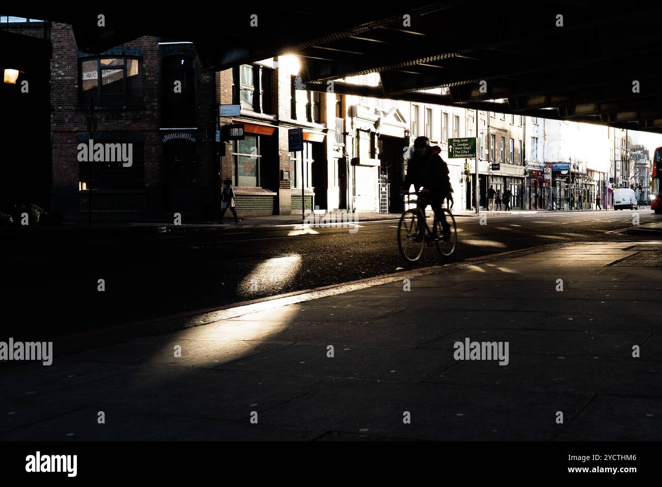 typical urban scene under a bridge featuring a rider Stock Photo - Alamy