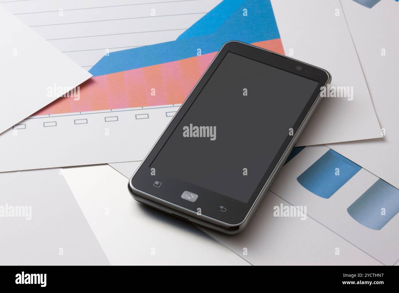 Smartphones and graphical documents Stock Photo - Alamy