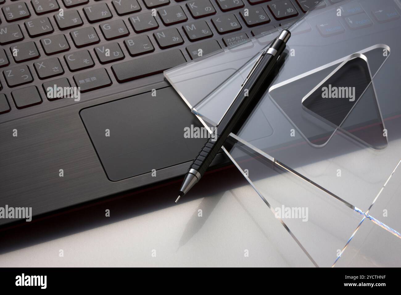 Triangular ruler and pencil on top of laptop Stock Photo - Alamy