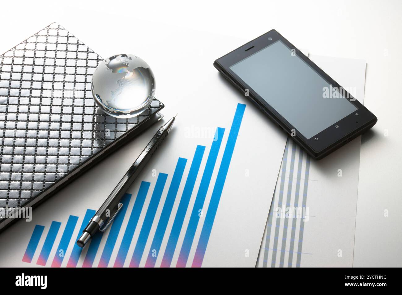 Smartphones and graphical documents Stock Photo - Alamy