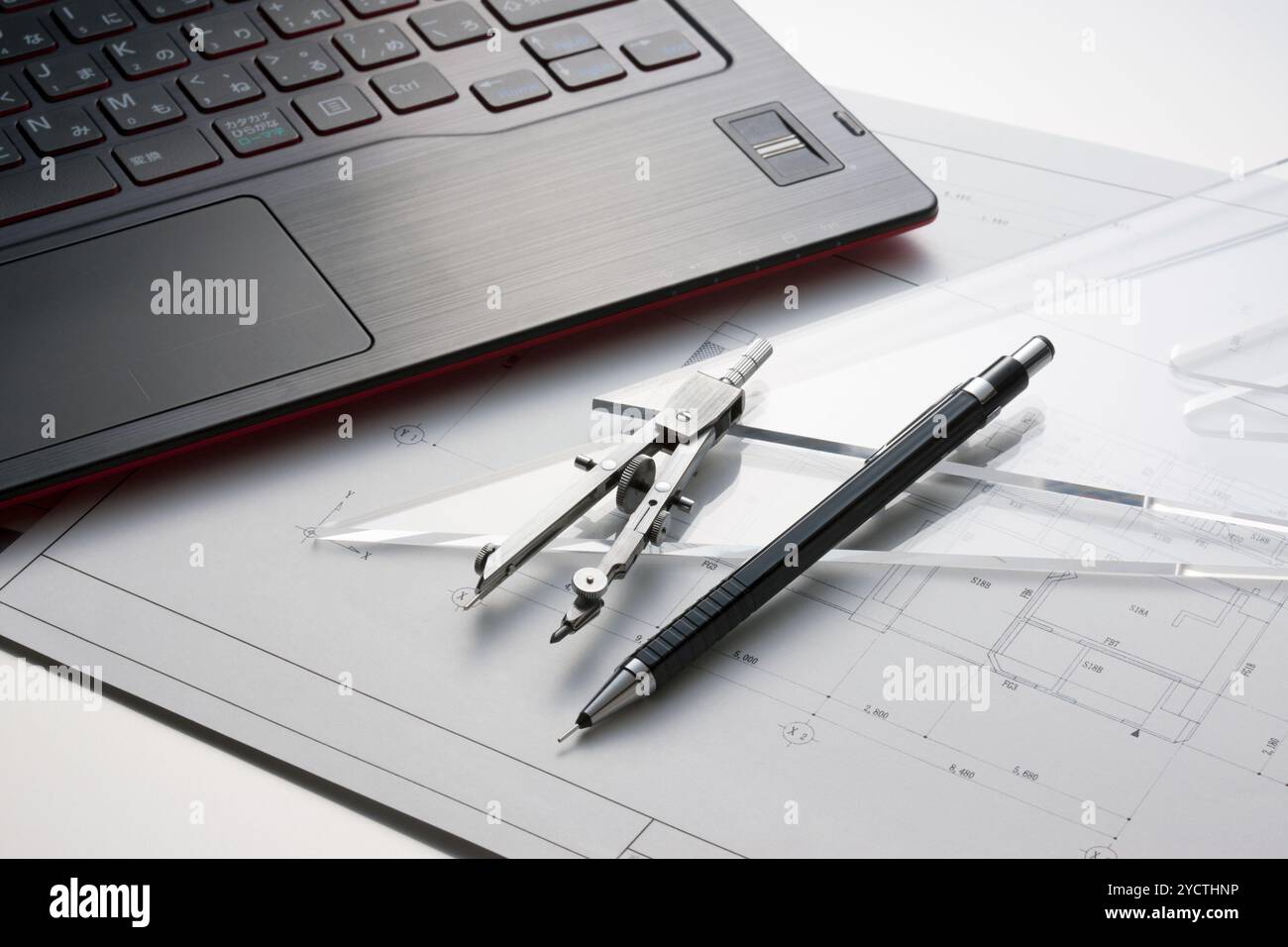 Compass and triangular ruler on a drawing Stock Photo - Alamy