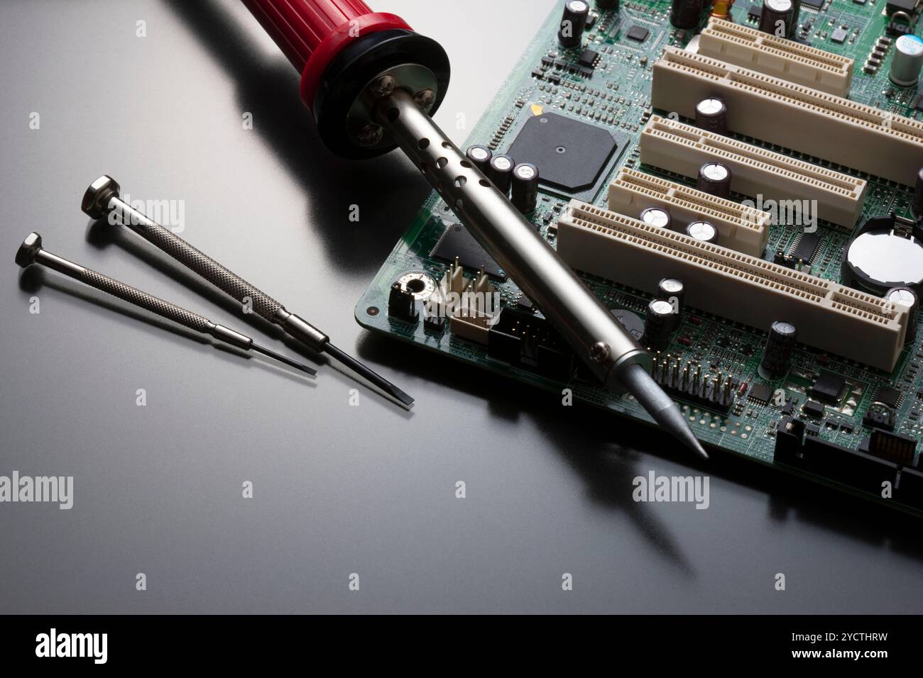 Base and soldering iron Stock Photo - Alamy