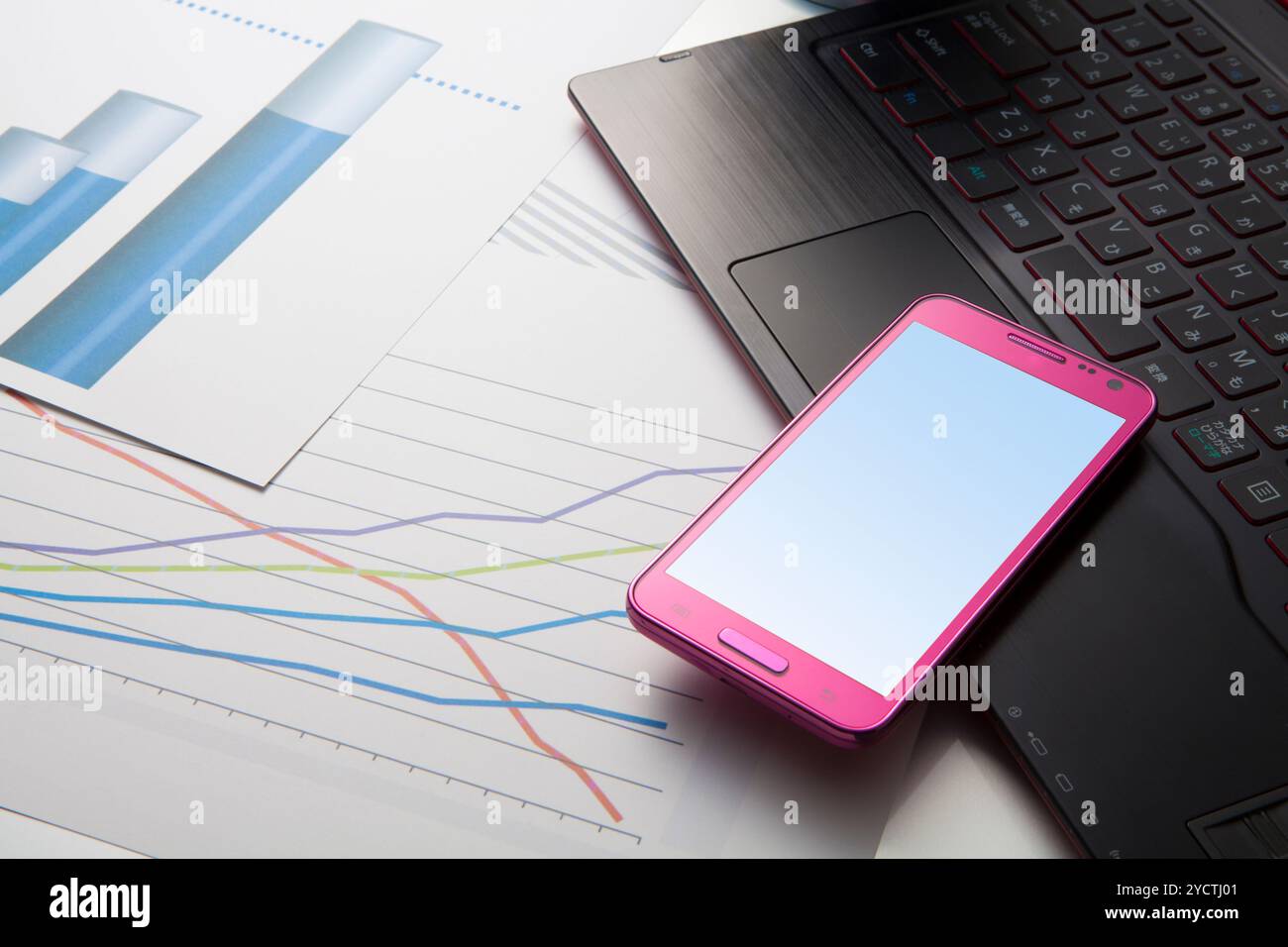 Smartphones and graphical documents Stock Photo - Alamy