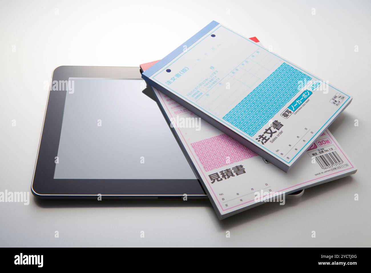 Tablet PC and voucher Stock Photo - Alamy