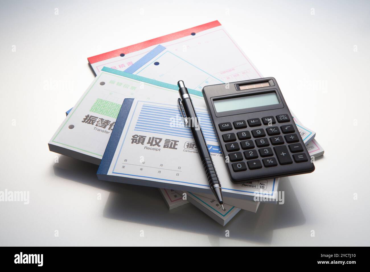 Slip and calculator Stock Photo - Alamy