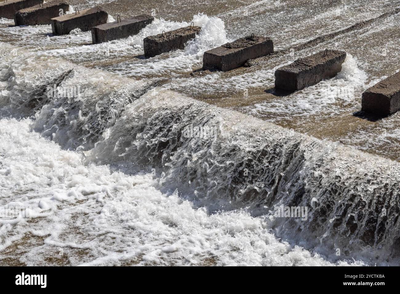 chute dentate blocks in concrete water spillway channel Stock Photo - Alamy