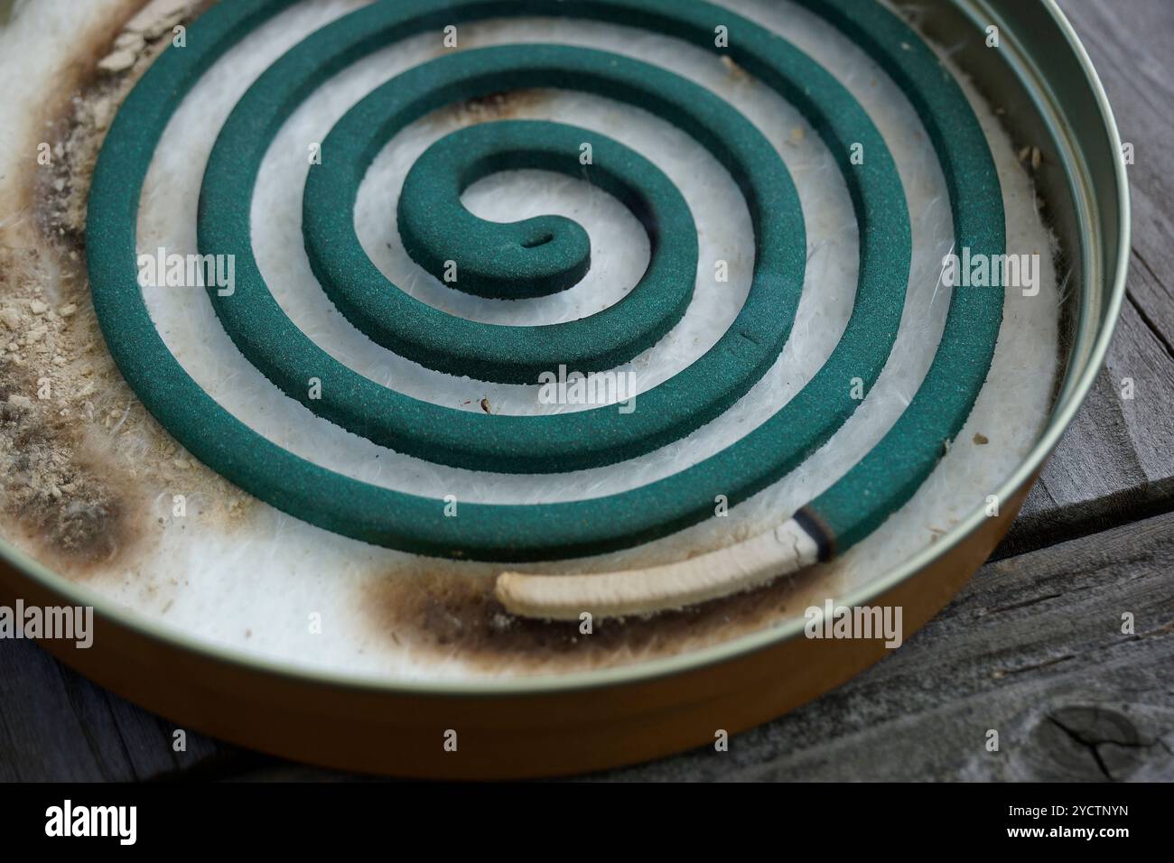 Mosquito coils burning outdoors Stock Photo - Alamy