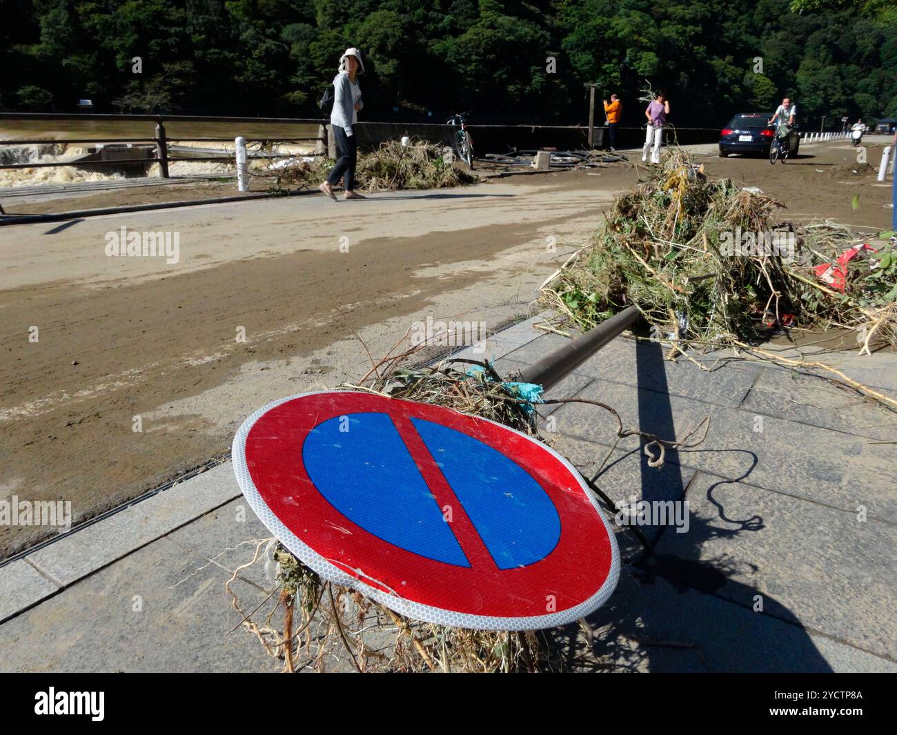 Road sign collapsed by flood disaster on the Kyoto Ranzan Katsura River ...