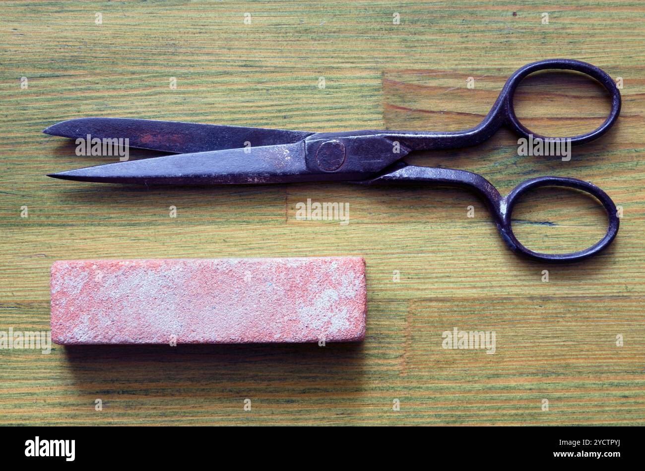 Grindstone with scissors Stock Photo - Alamy