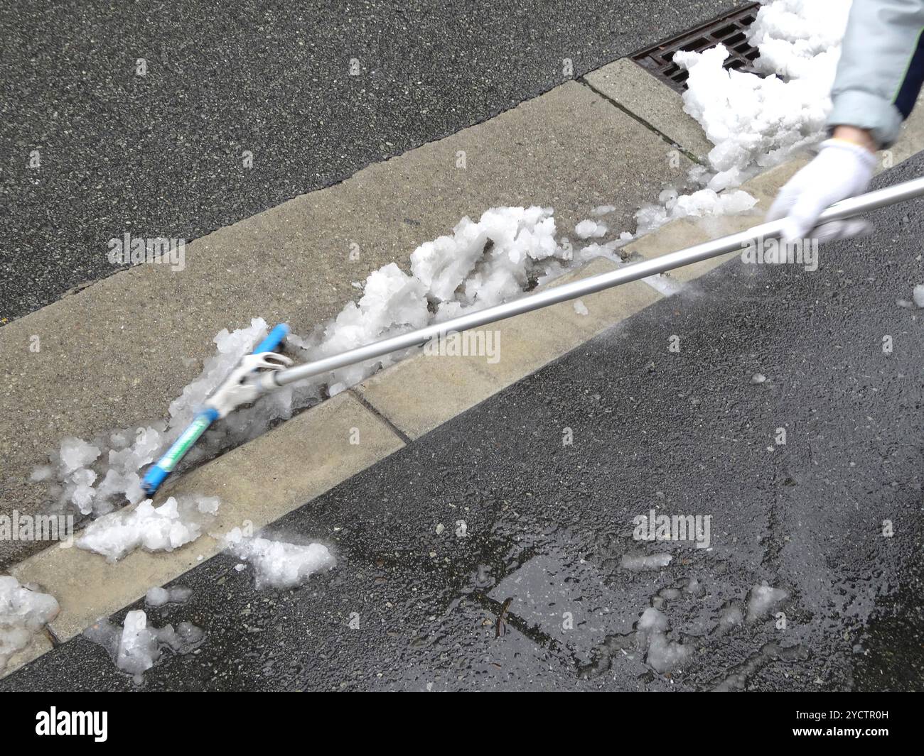 Snow ploughing in aisle Stock Photo - Alamy