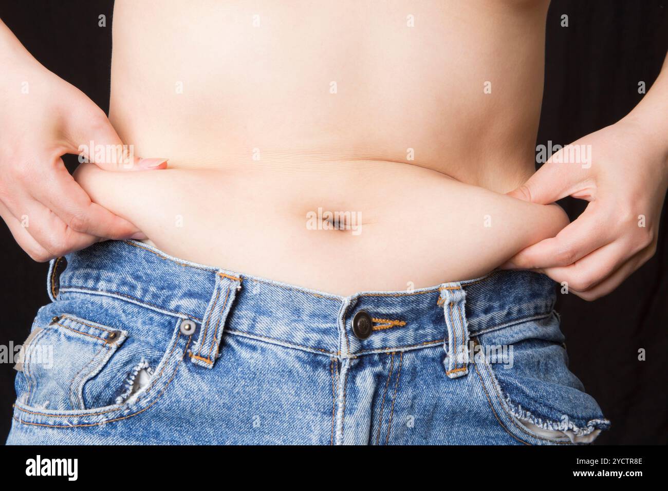 Fat woman's stomach Stock Photo - Alamy