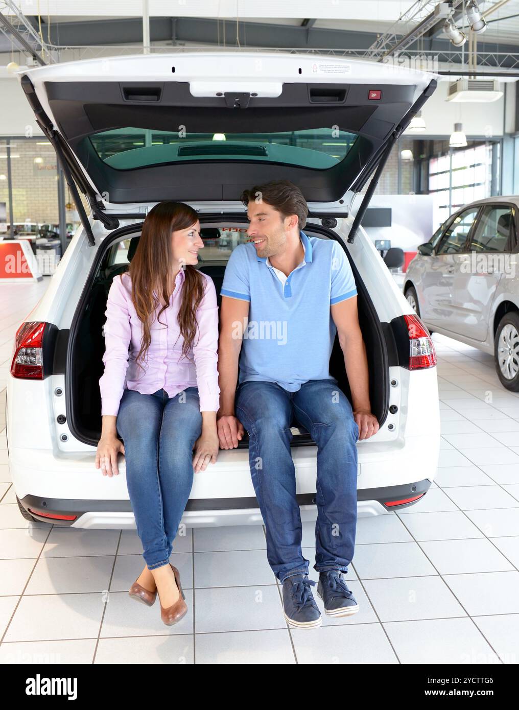 Young people buying new hi-res stock photography and images - Alamy