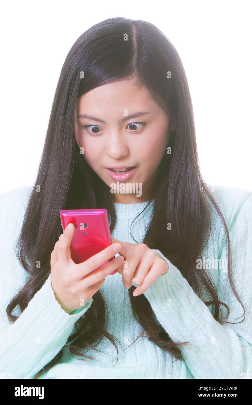 Woman surprised looking phone hi-res stock photography and images - Alamy