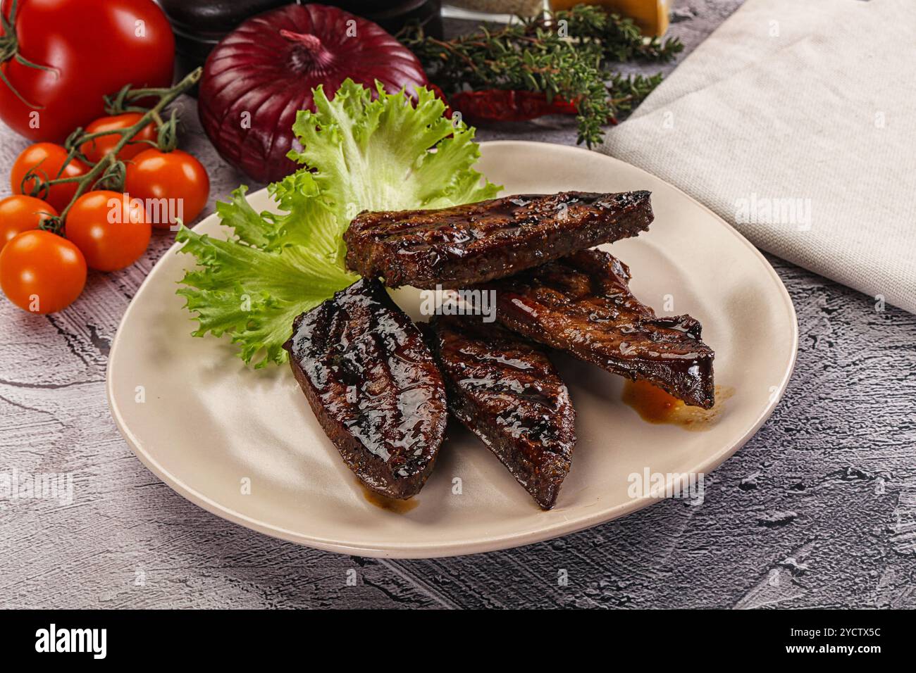 Grilled diet beef liver steak in the plate Stock Photo - Alamy
