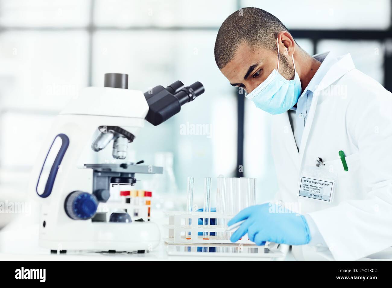 Man, science and blood at laboratory with tablet, vial and check notes ...