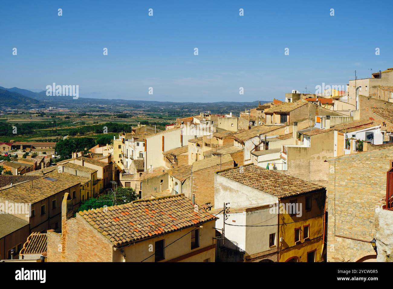 a birds eye view over the tiled roofs of Barbera de la Conca, a ...