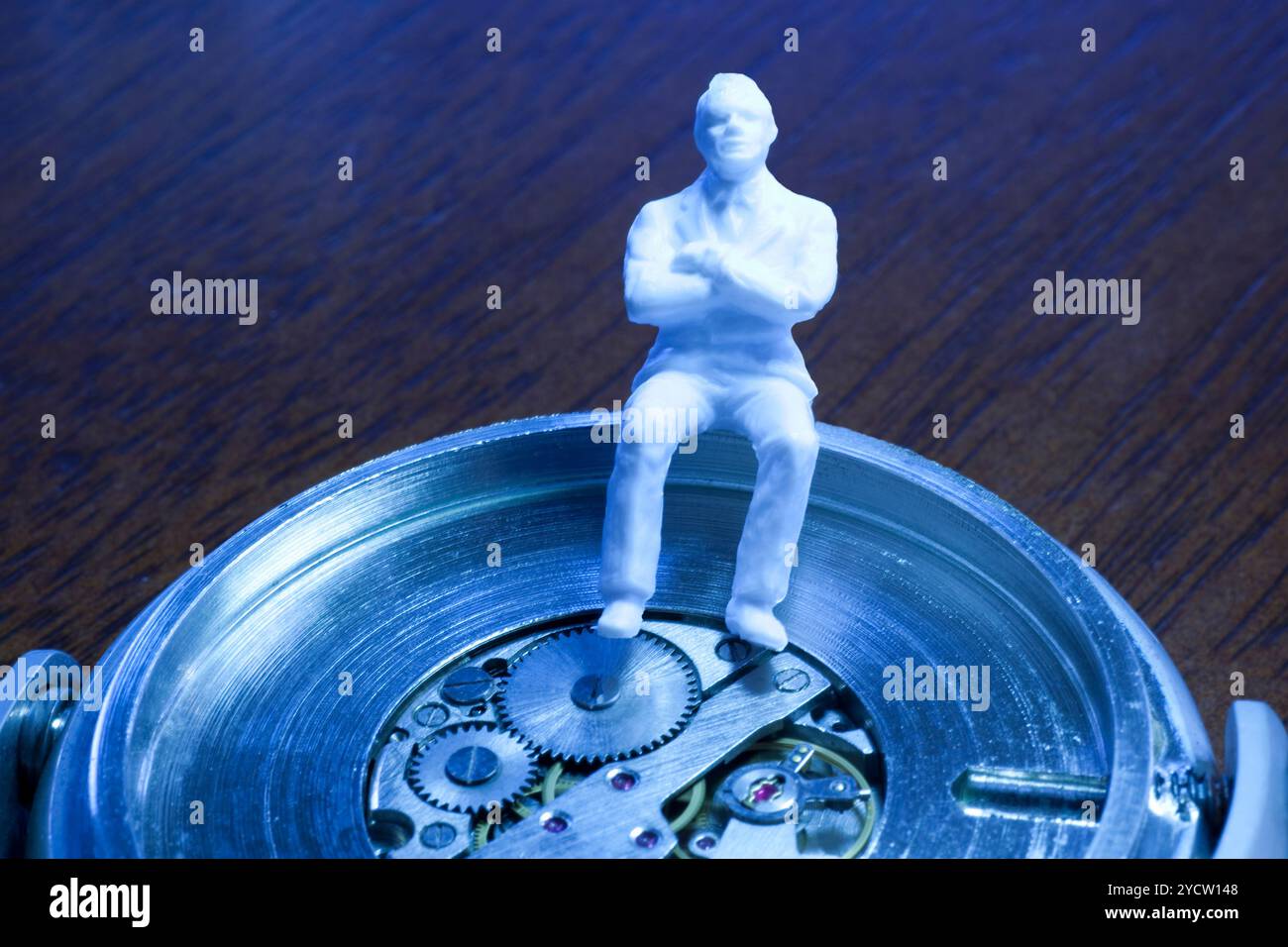 Clock and figurine Stock Photo - Alamy