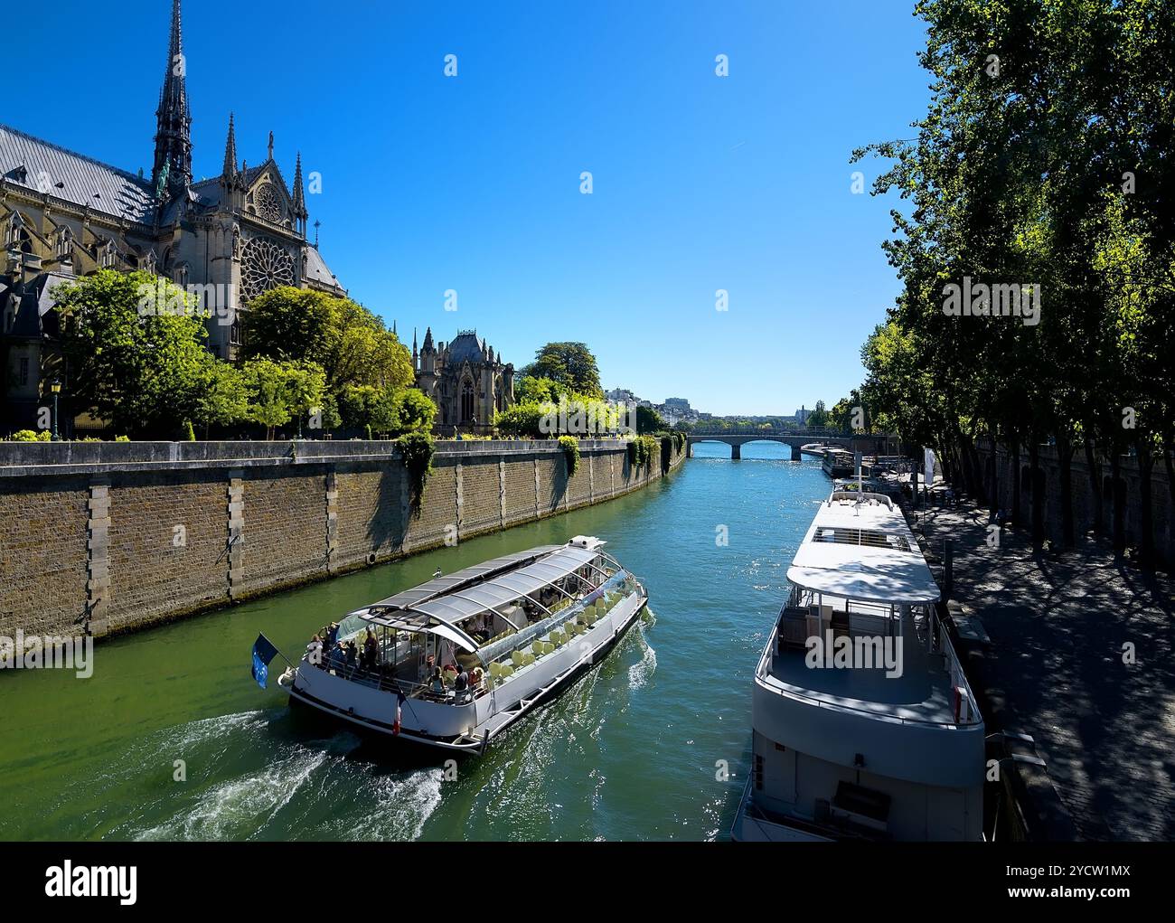 Boats near Notre Dame de Paris at summer day, France Stock Photo - Alamy