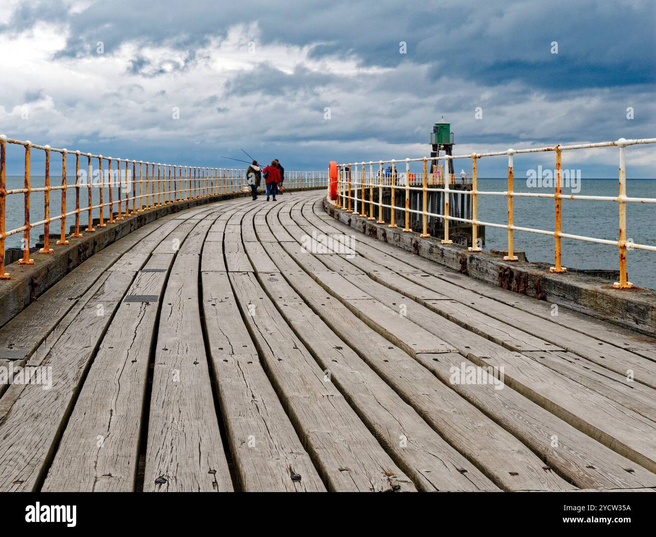 Whitby, North Yorkshire, looking out to sea along the outer pier ...
