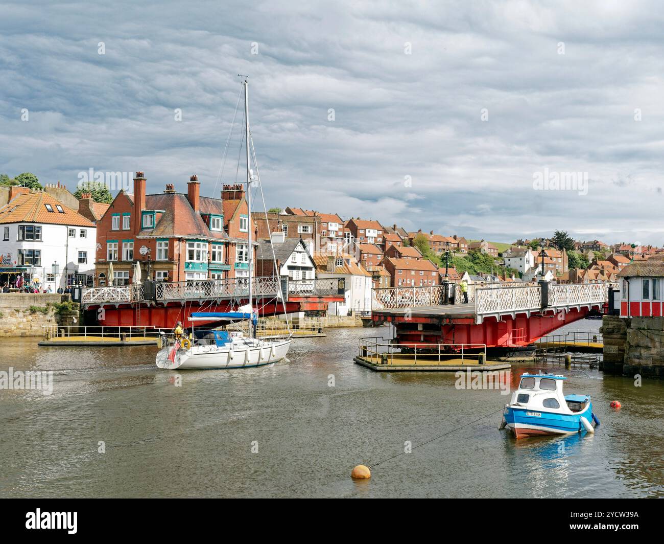 The swing bridge across Whitby harbour, North Yorkshire being opened to ...