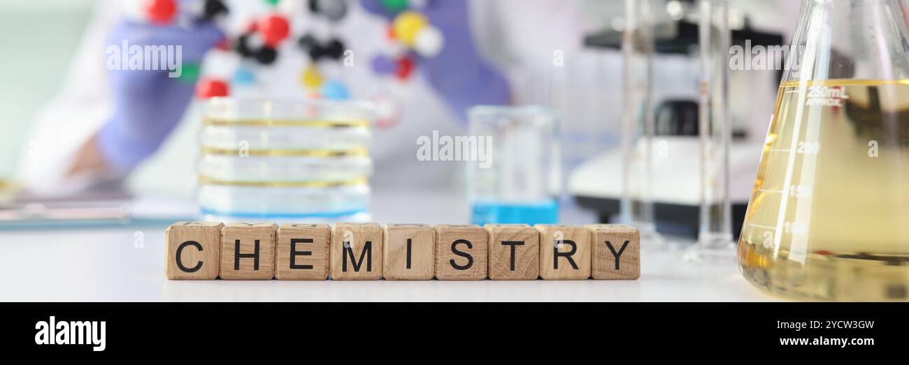 Word Chemistry against lab assistant showing molecule model Stock Photo ...