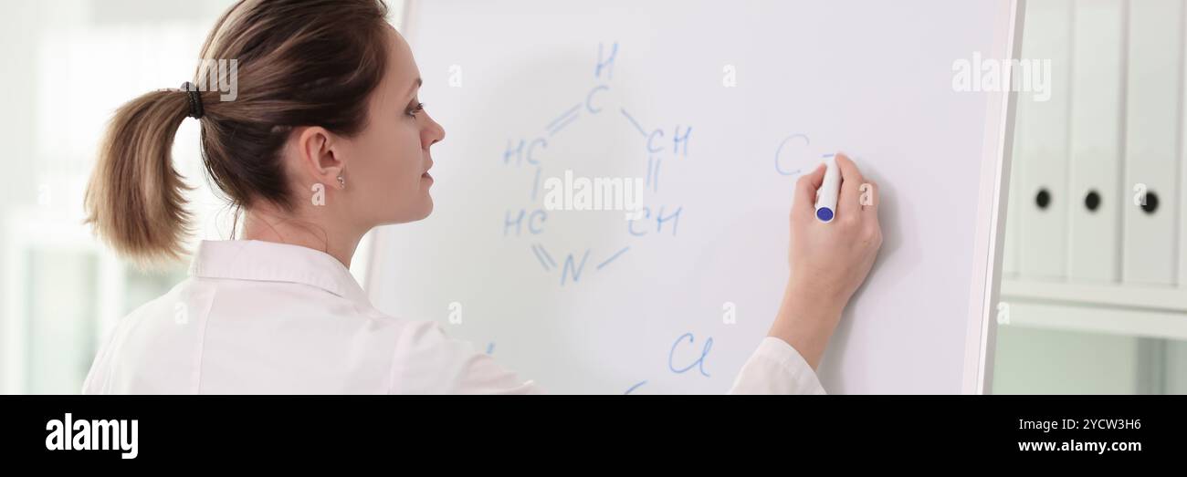 Woman writes chemical formulas on hi-res stock photography and images ...
