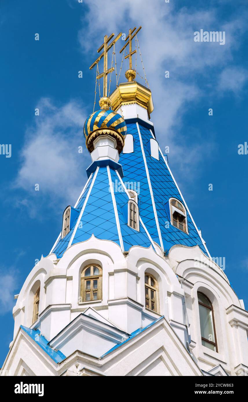 Blue domes with golden crosses of orthodox church against the blue sky ...
