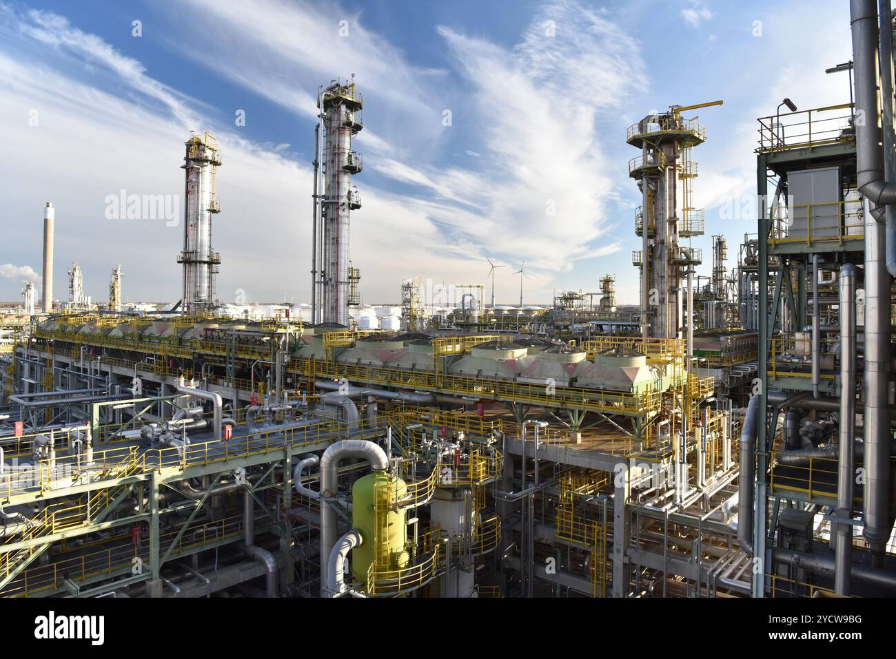 refinery - chemical factory at night with buildings, pipelines and ...