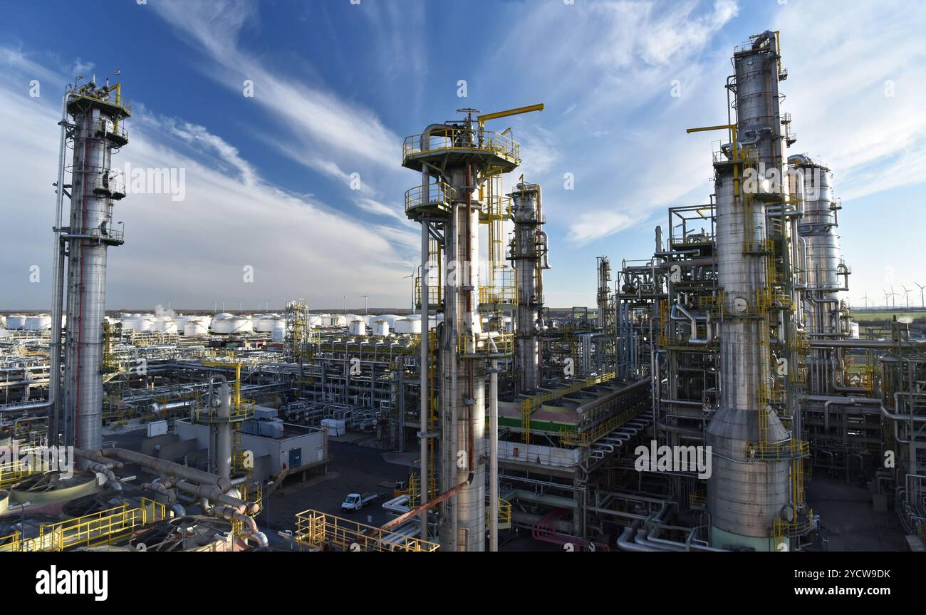 refinery - chemical factory at night with buildings, pipelines and ...
