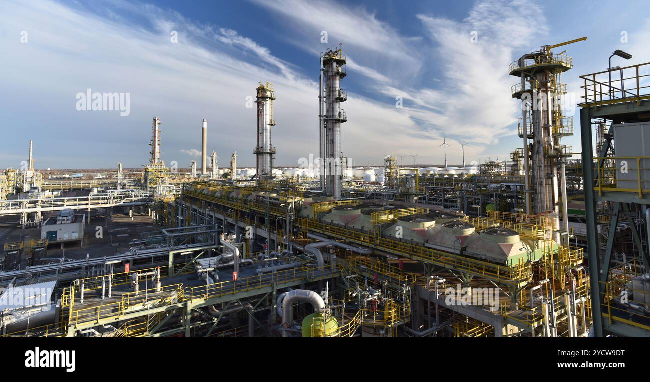 refinery - chemical factory at night with buildings, pipelines and ...