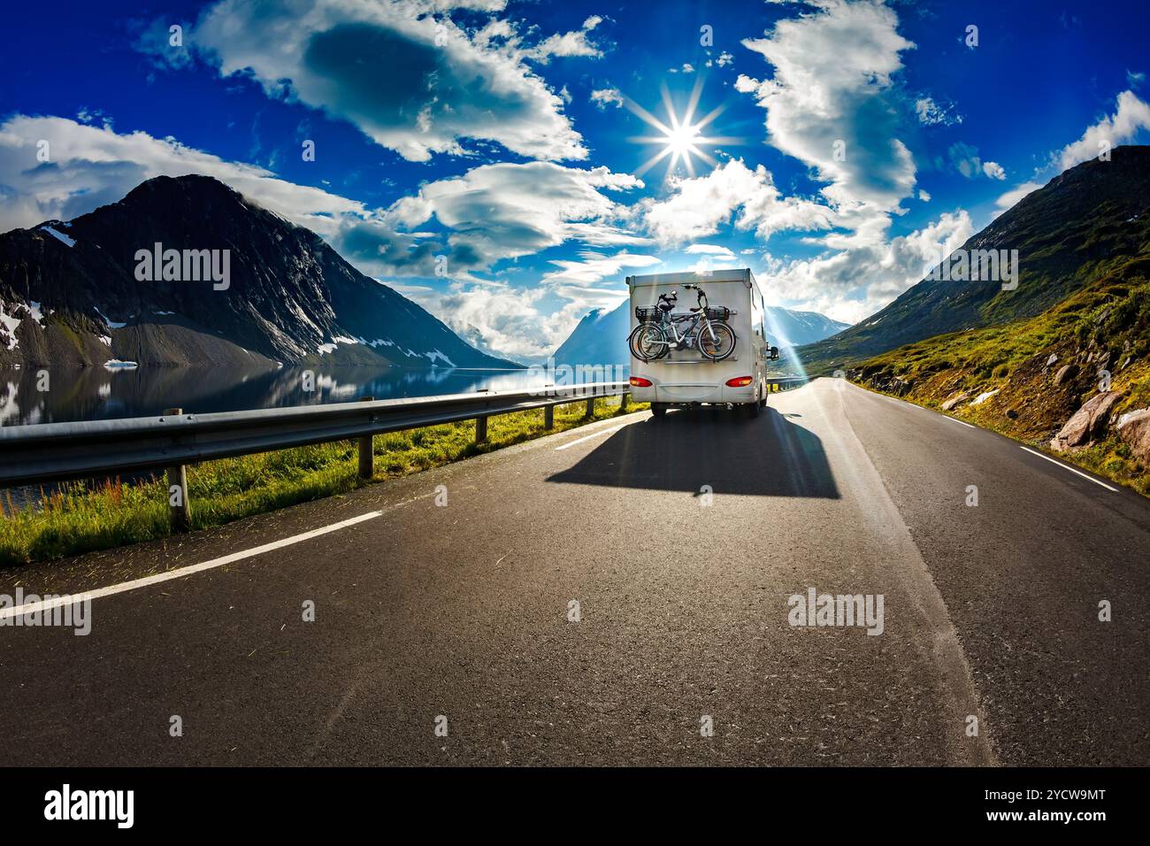Caravan car travels on the highway Stock Photo - Alamy