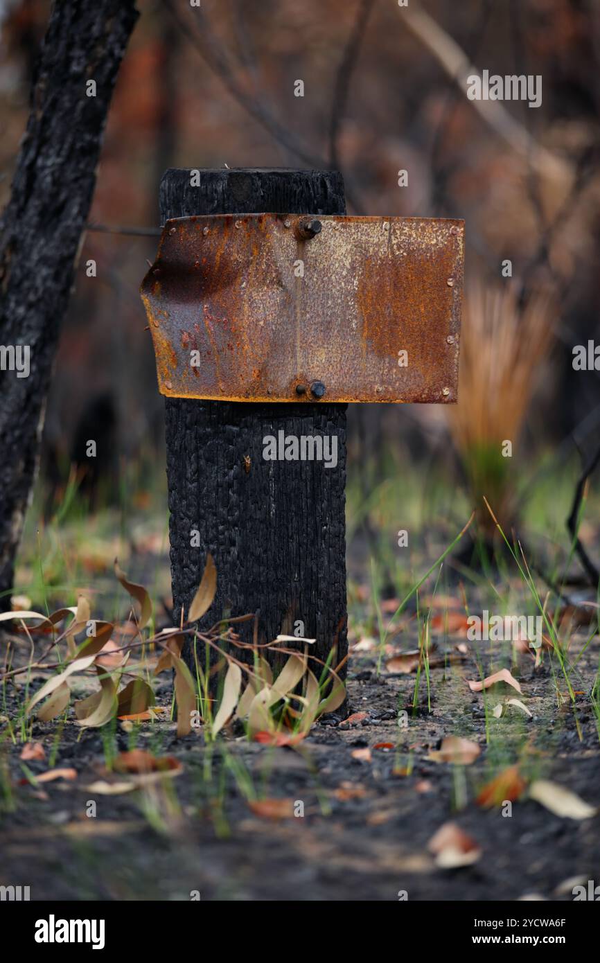After the Patonga fires of December 2016. This old sign and post among ...
