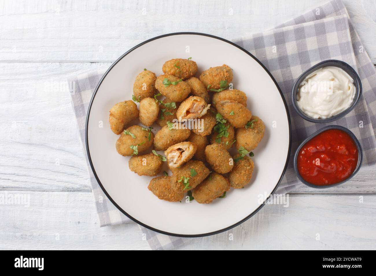 Delicious fresh breaded mussels served with mayonnaise and ketchup ...