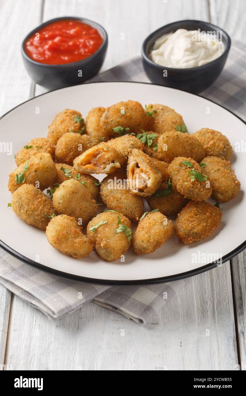 Appetizer Fried breaded mussels served with mayonnaise and ketchup ...