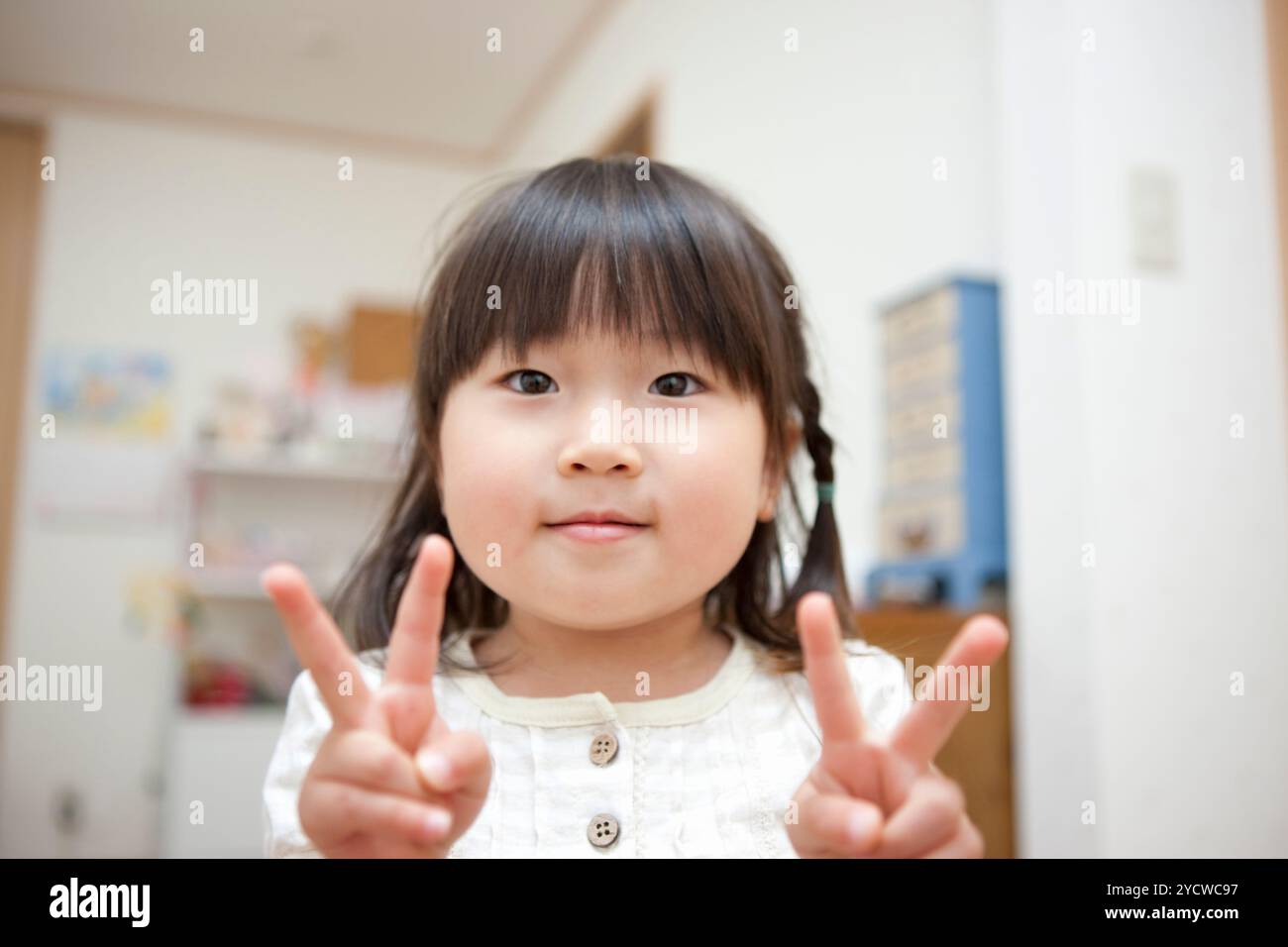 Girl with v sign hi-res stock photography and images - Alamy