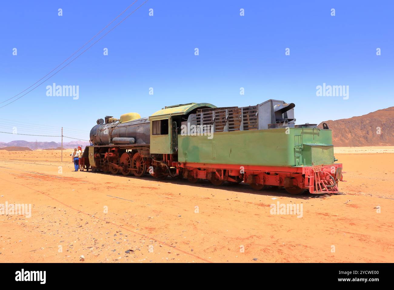 Wadi Rum in Jordan - May 15 2024: people visit the old Locomotive train ...