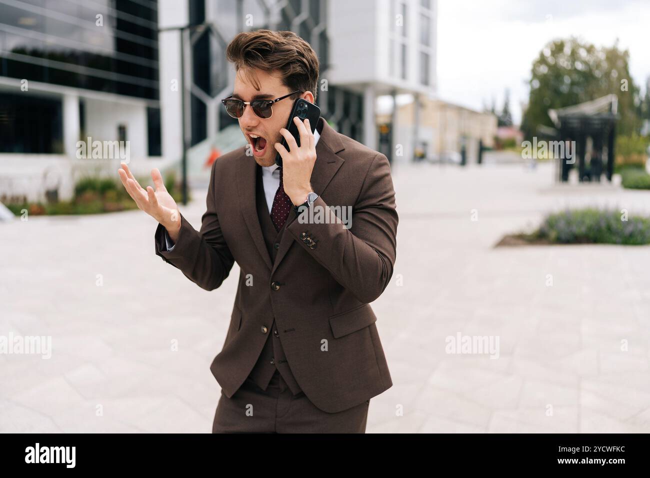 Young businessman talking angrily on hi-res stock photography and ...