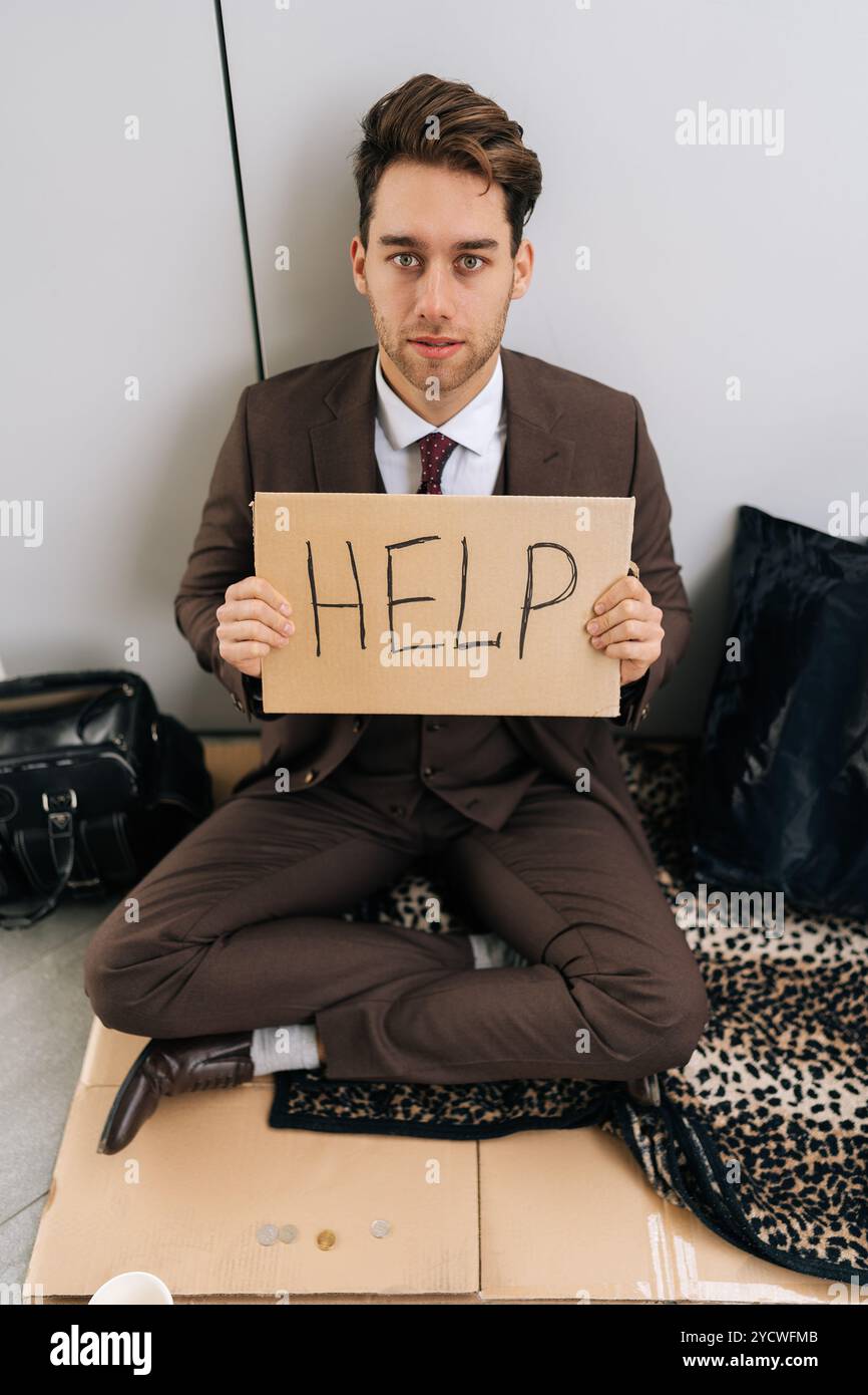 Full length vertical portrait of homeless businessman in suit and tie ...
