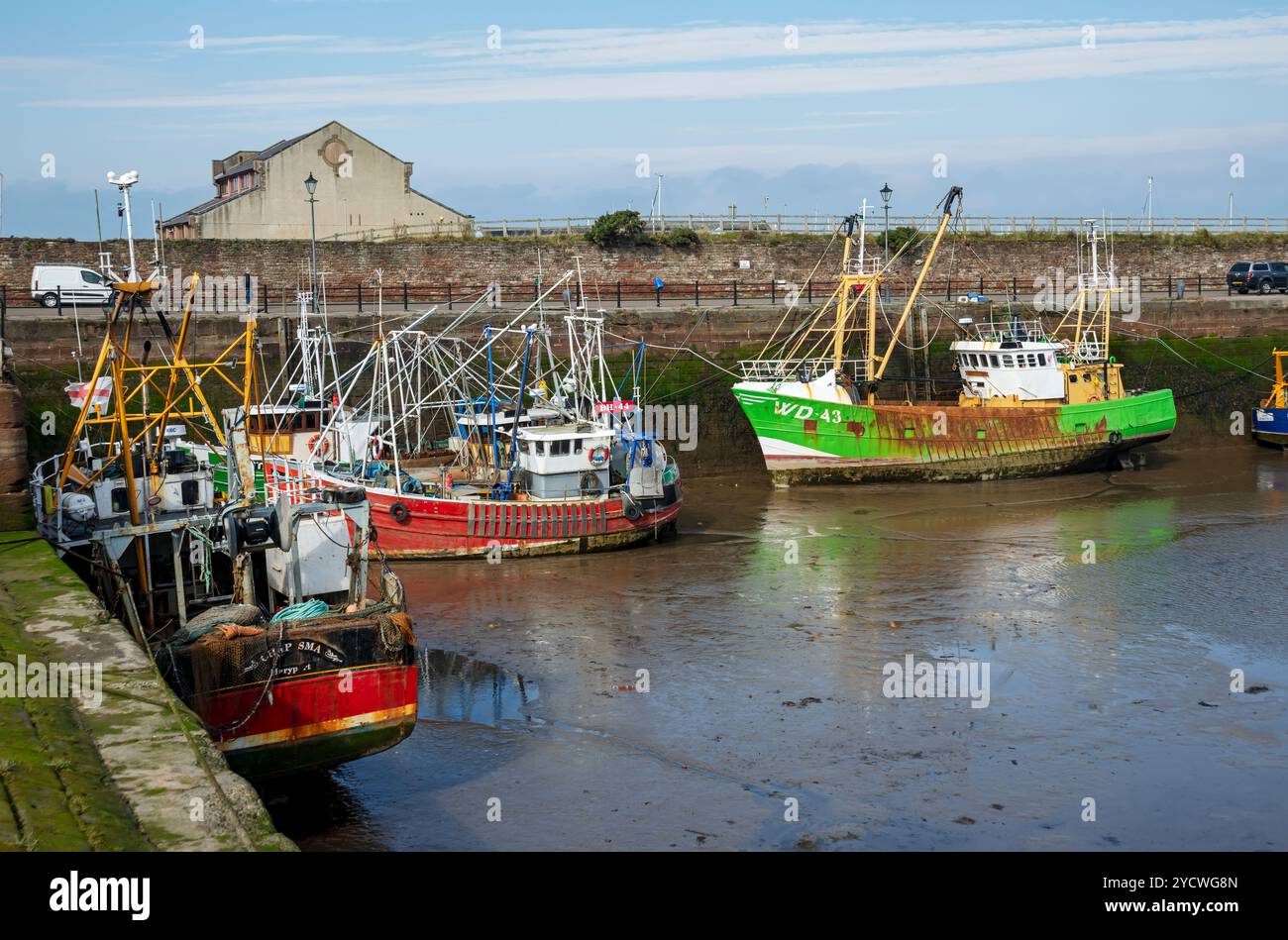 Fishing trawlers boats in the harbour quay quayside at low tide ...