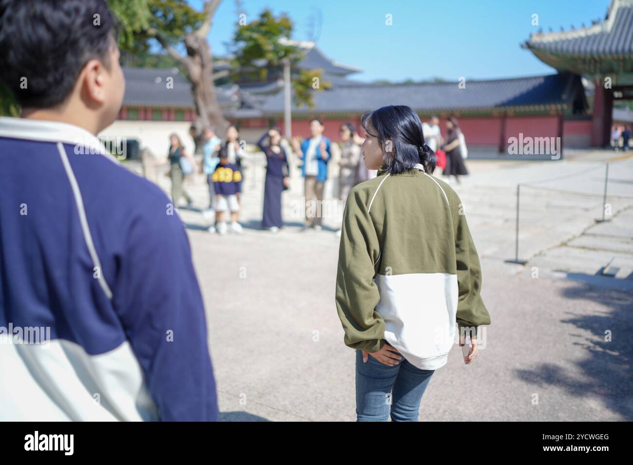 A Korean couple, a man in his 30s and a woman in her 20s, walks ...