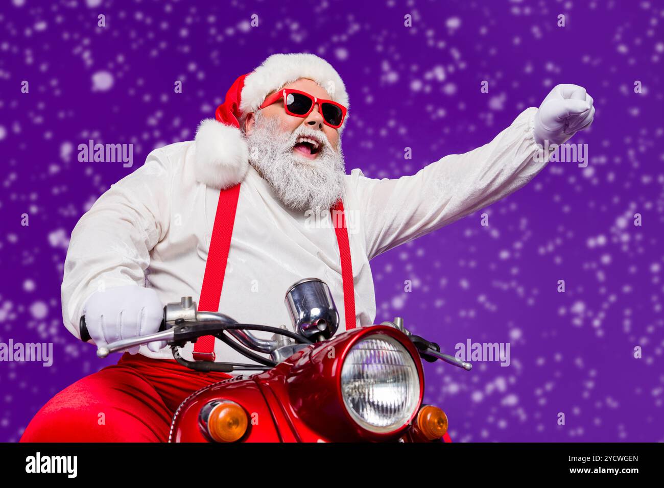 Photo of santa claus role man rapid riding newyear party by bike ...