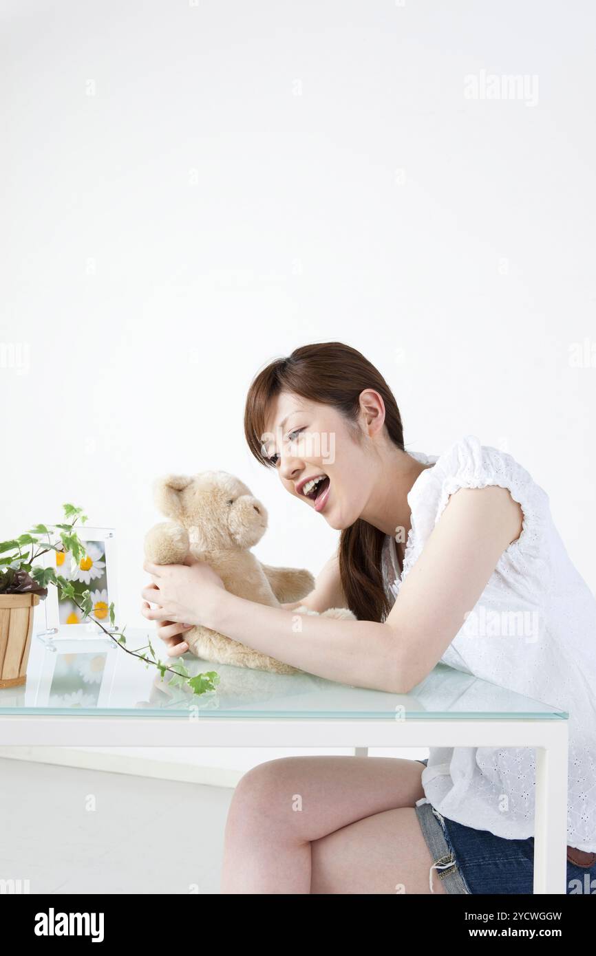 Woman playing stuffed animals hi-res stock photography and images - Alamy