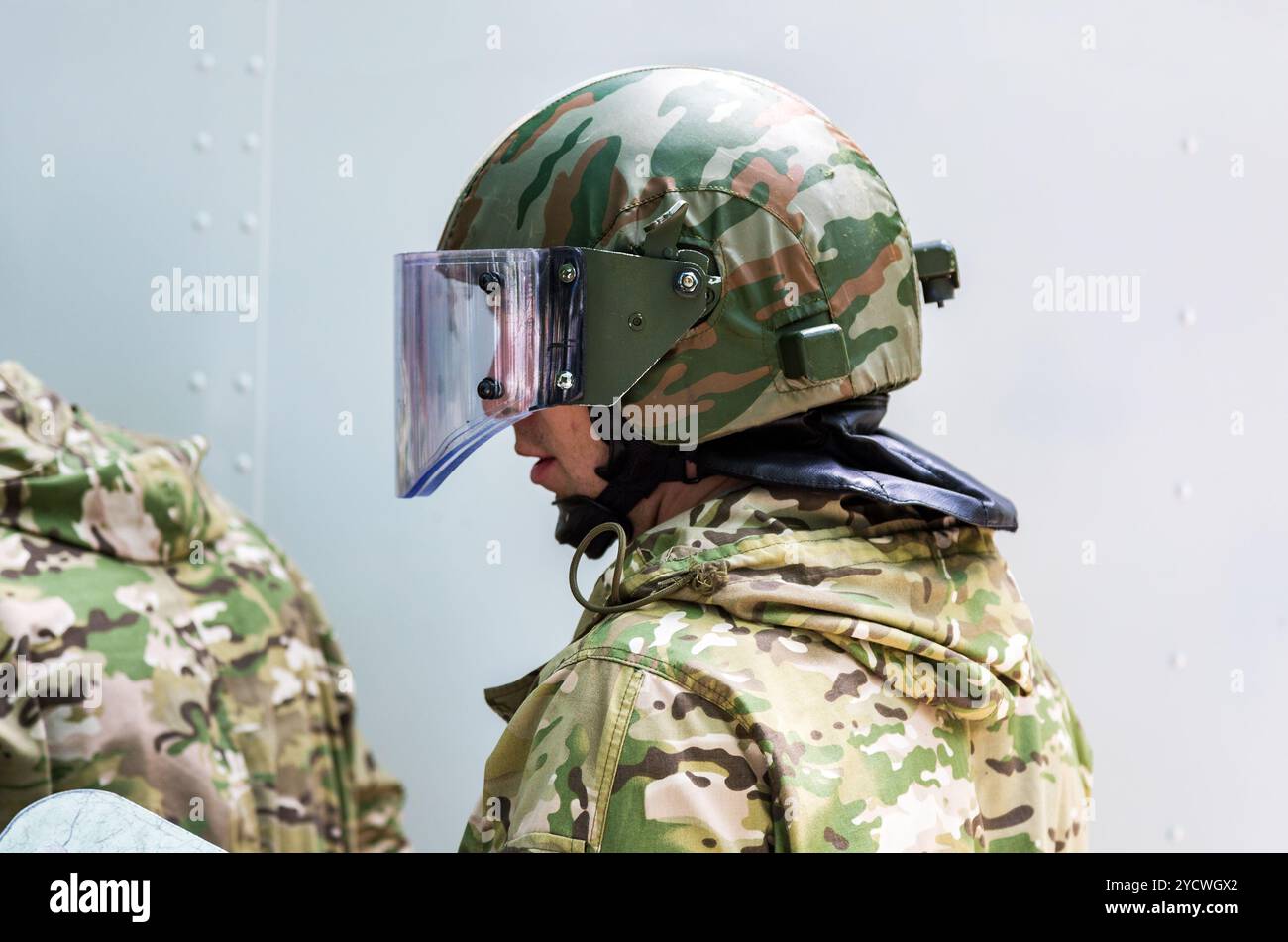 Special Forces soldier in protective helmet with glasses and camouflage ...