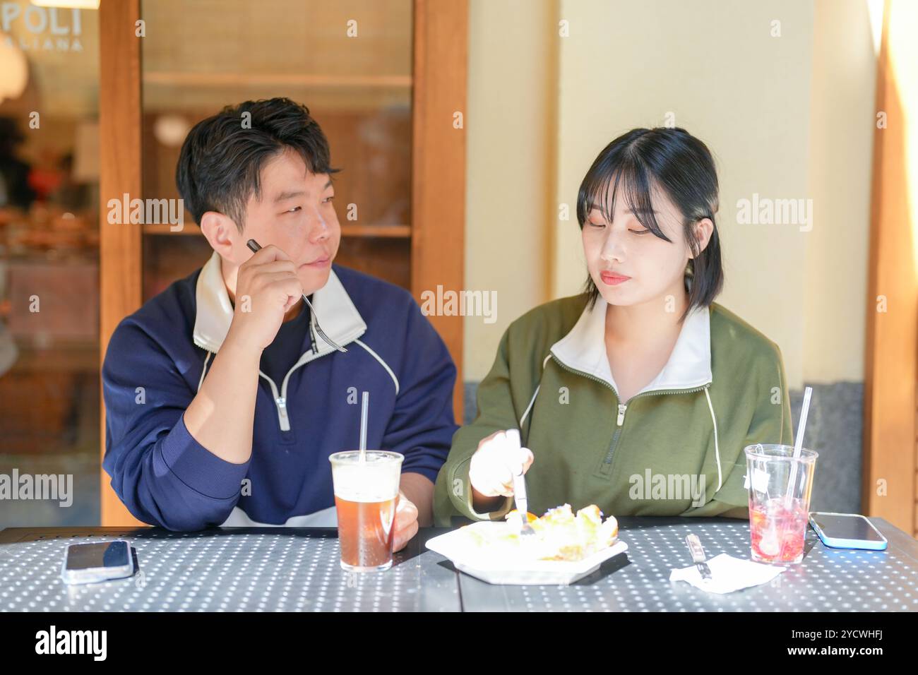 A couple, a Korean man in his 30s and a woman in her 20s, wear ...