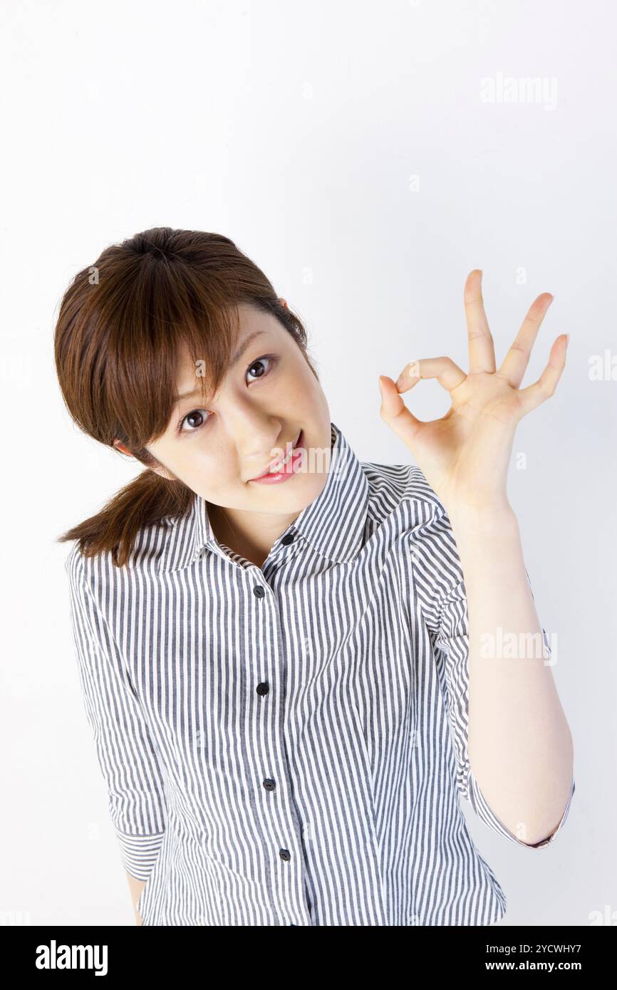 Woman giving the ‘okke’ sign Stock Photo - Alamy