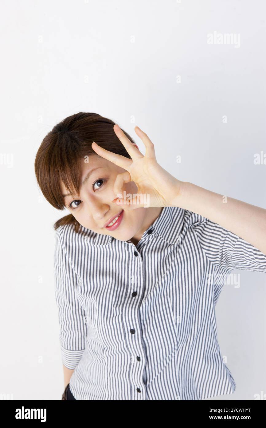 Woman giving the ‘okke’ sign Stock Photo - Alamy