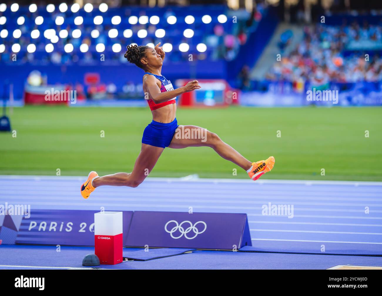 Monae' Nichols participating in the long jump at the Paris 2024 Olympic ...